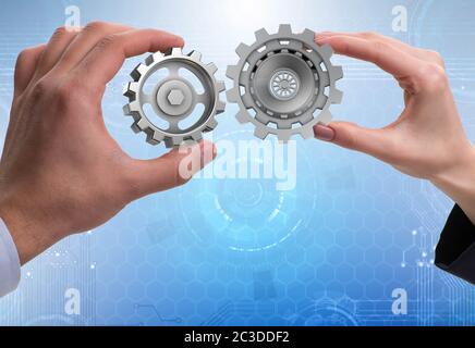 The teamwork concept with businessman and cogwheels Stock Photo - Alamy