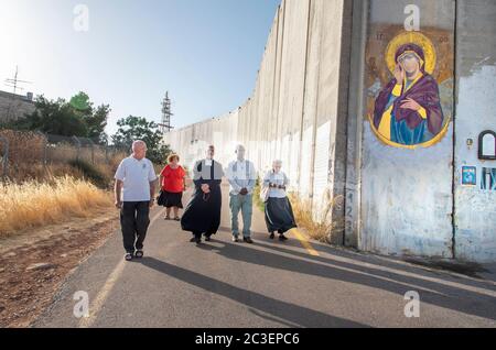 Brother Peter Bray with Mrs Clemence Handal- lives near the wall and ...
