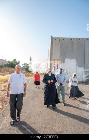 Brother Peter Bray with Mrs Clemence Handal- lives near the wall and ...