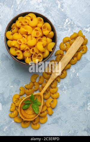 Italian yellow pasta made from durum wheat, vermicelli shells scattered ...