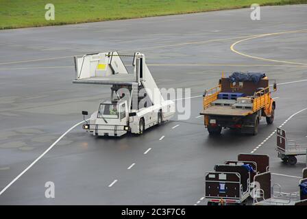 Airport movable ramp. Car ramps driving across the airfield Stock Photo ...