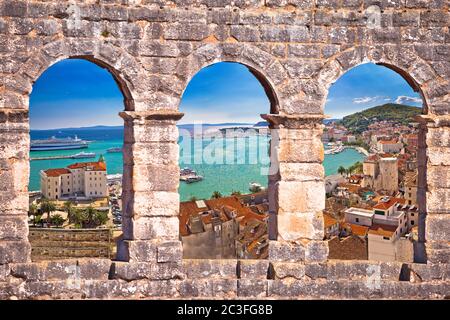 Split waterfront aerial panoramic view through stone window Stock Photo ...