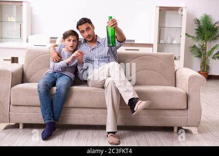 Drunk father and his son Stock Photo - Alamy