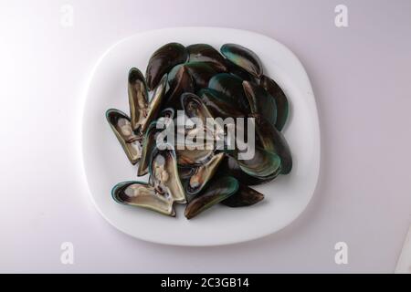 Kerala raw Mussels,kerala raw shell fishes arranged in a white plate ...