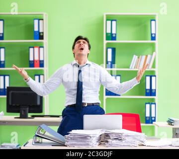 Frustrated businessman stressed from excessive work Stock Photo - Alamy
