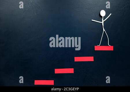 Ladder to success concept. Human stick figure taking first step on a ...