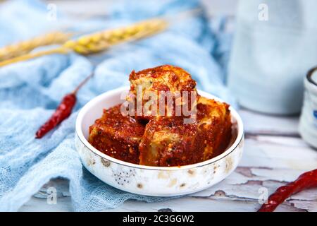 Still life with fermented, salted food. Jar with pickled chili peppers ...