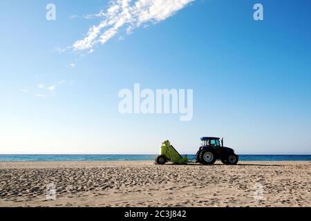 Seaside beach cleaning machine tractor pulled seen here in action in ...