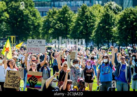Protesters hold up placards as they demonstrate outside Downing Street ...