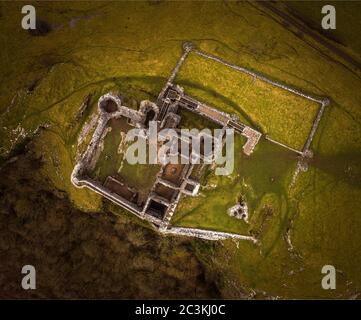 Overhead shot of medieval castle ruins encircled by water, showcasing ...