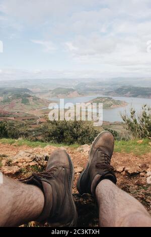 A vertical shot of a black rubber boot isolated on the coast Stock ...