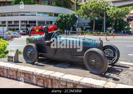 Bronze Formula one car statue on roundabout beside Monaco Grand Prix ...