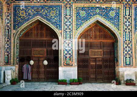 The arch and the exterior design of the ancient Registan in Samarkand ...