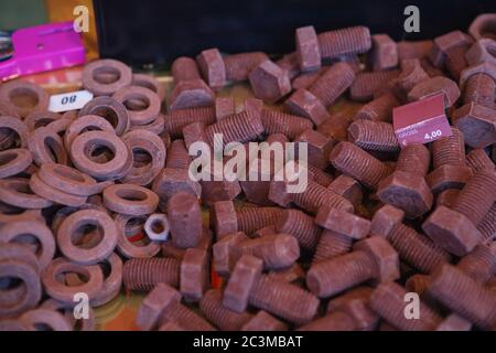 reproduction in milk chocolate, screws and bolts Stock Photo - Alamy