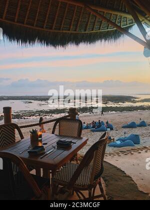 (Selective focus) Beautiful and relaxing beach flanked by green palm ...