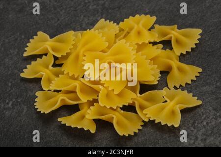 Raw dry farfalle pasta ready for cooking Stock Photo - Alamy