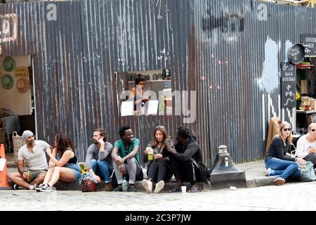 A woman looks at a flower stall in Rundle Mall Adelaide, Australia ...