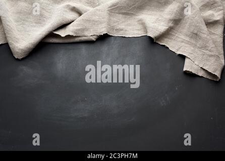 gray kitchen textile towel folded on a brown wooden table from old ...