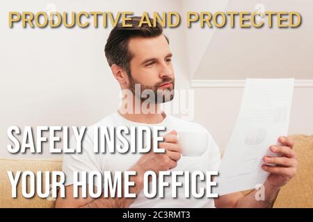 Handsome teleworker holding document and drinking coffee on couch Stock ...