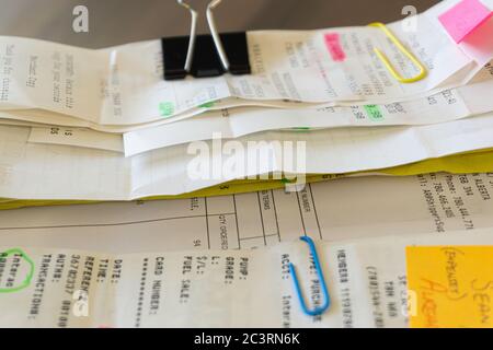 Credit card slips and invoices to claim business expenses on an expense ...