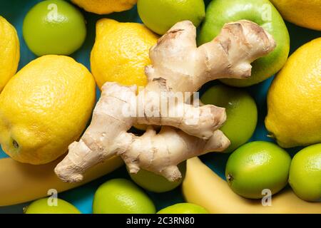 A top view of apples, ginger root, blueberries, and seasoning on a ...