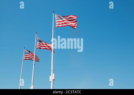 Three flags of the United States of America (USA) on a white background ...