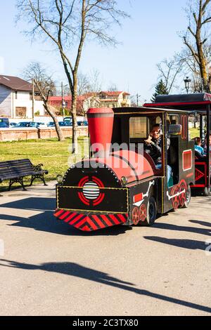 Tourists having a train ride in the Mary Ann replica steam locomotive ...