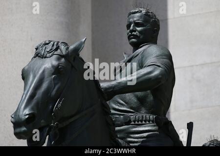 Police barricades surround the area around a bronze statue of former ...
