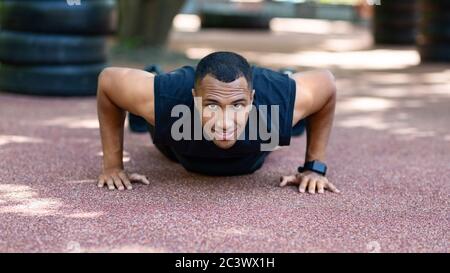 Sportsman doing push-up exercises in desert Stock Photo - Alamy