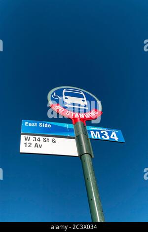 Bus Stop No Standing sign on street in Manhattan Stock Photo - Alamy