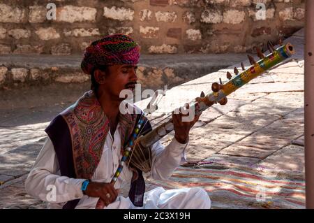 Indian folk artist playing ravanahatha violin at Jaisalmer fort in the ...