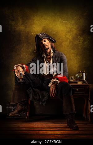 Portrait of a pirate drinking rum, sitting in a tavern Stock Photo - Alamy