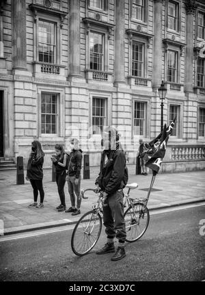 Protesters march through Trafalgar Square, towards Downing Street ...
