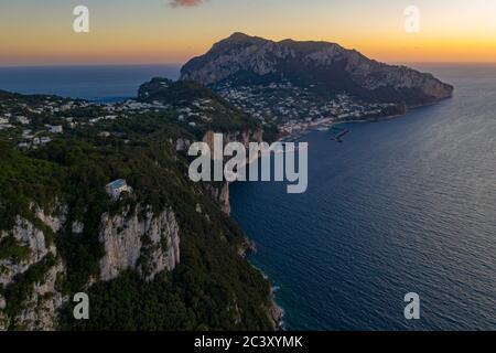 Aerial View of Villa Lysis / Fersen at sunset, submersed in the ...