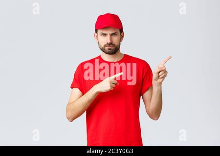 Online shopping concept. Angry frowning girl pointing at mobile phone ...