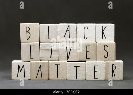 Wooden letters forming words 'Black lives matter' on dark black ...