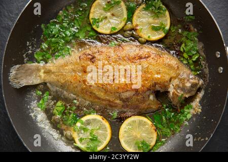 A home cooked whole lemon sole, Microstomus kitt, that has been pan ...