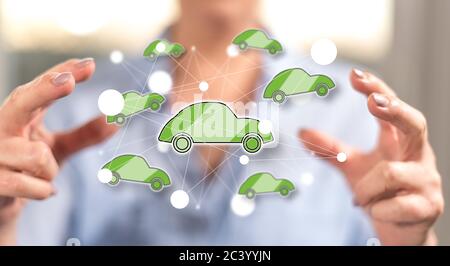 Connected car concept between hands of a woman in background Stock ...