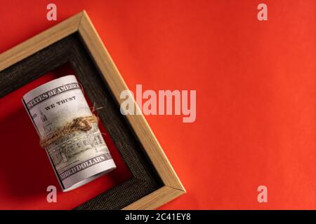US dollar bills against red background Stock Photo - Alamy