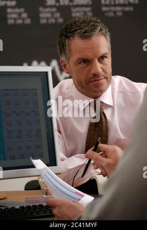 Two stockbrokers at work Stock Photo - Alamy