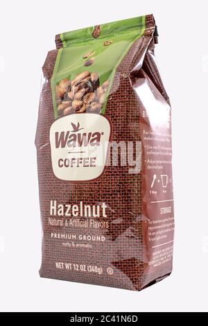 Wawa hazelnut coffee bag close-up with a brewed cup of steaming Wawa ...