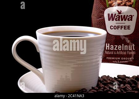 Wawa hazelnut coffee bag close-up with a brewed cup of steaming Wawa ...