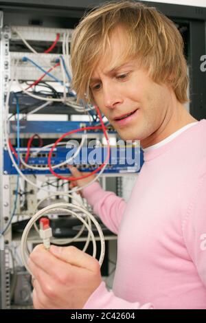 man connects a network cables Stock Photo - Alamy