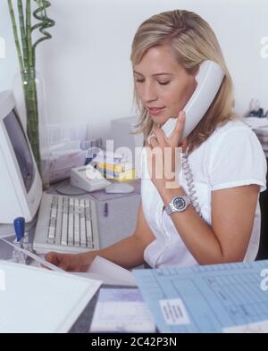 Secretary on the phone at the reception - doctor's office Stock Photo ...