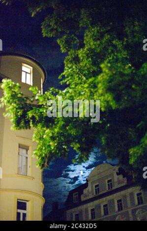 Full moon between clouds, Munich, Bavaria, Germany Stock Photo - Alamy