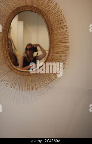 Sneaky self portrait in the mirror Stock Photo - Alamy