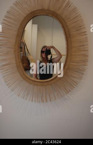 Sneaky self portrait in the mirror Stock Photo - Alamy