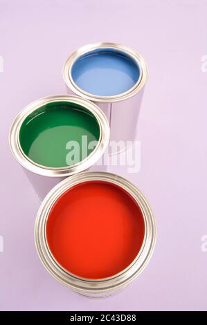 Three cans of red, blue and green color Stock Photo - Alamy