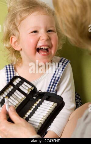 Infant is given medication Stock Photo - Alamy