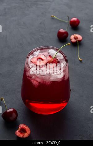 Beverage compote of red berries black currant cherries blueberries in ...